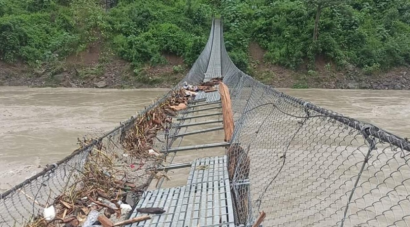 Suspension bridge connecting two districts at risk due to flood in ...